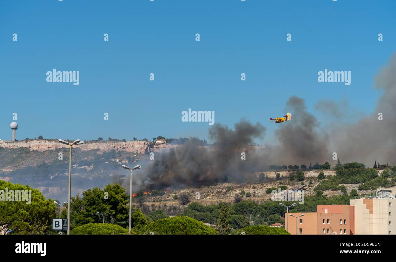 fire starts on the hills of Marseille, near Marignane airport. yellow ...