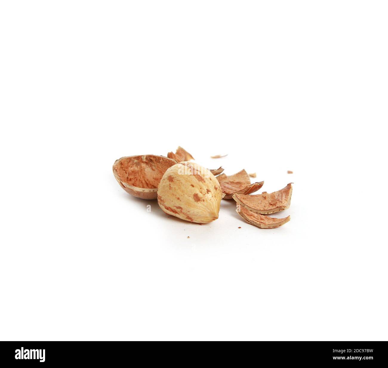 A broken almond isolated on a white background Stock Photo - Alamy
