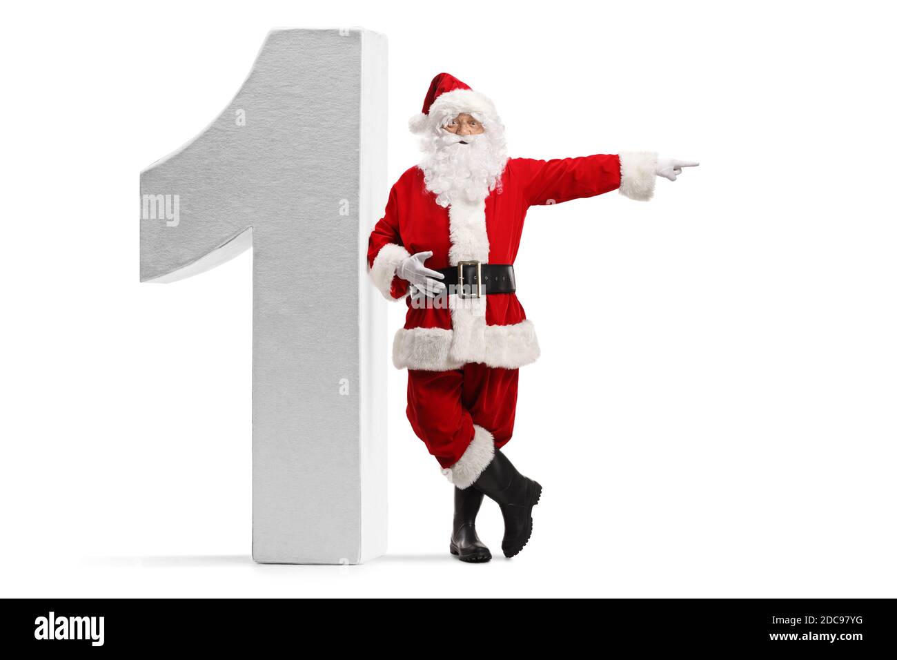 Full length portrait of Santa Claus pointing to the side and leaning on ...