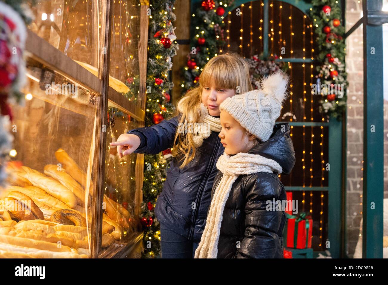 Children choosing bread in bakery in evening Stock Photo - Alamy