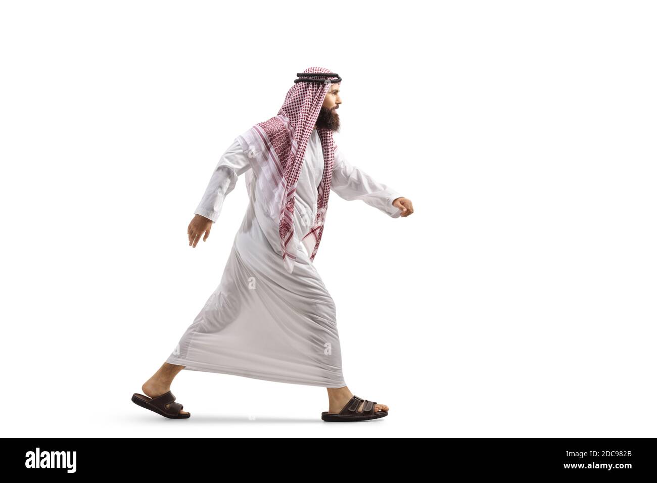 Full length profile shot of a saudi arab man in a thobe running ...