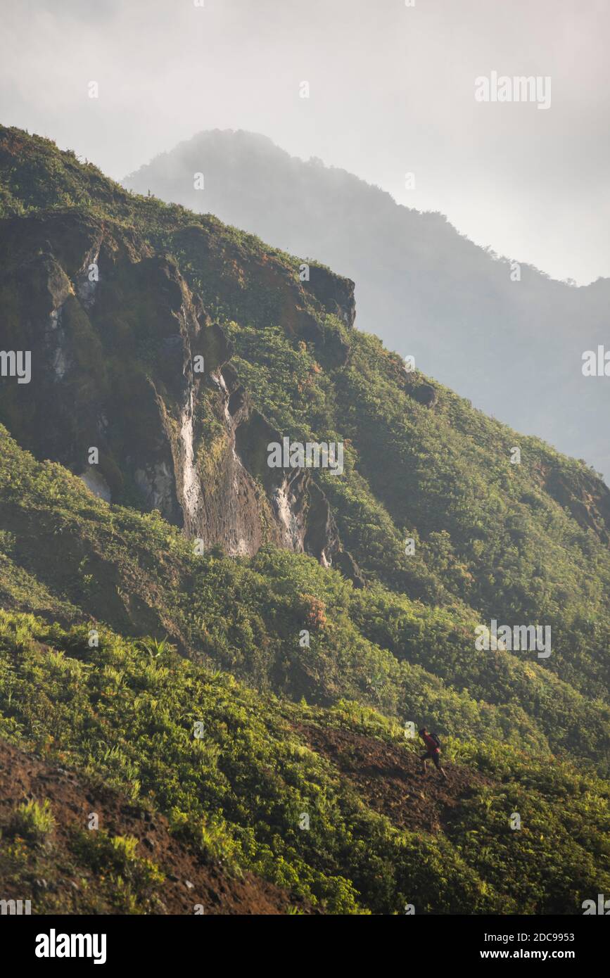 Hiker climbing to the top of Sibayak Volcano at sunrise, Berastagi ...