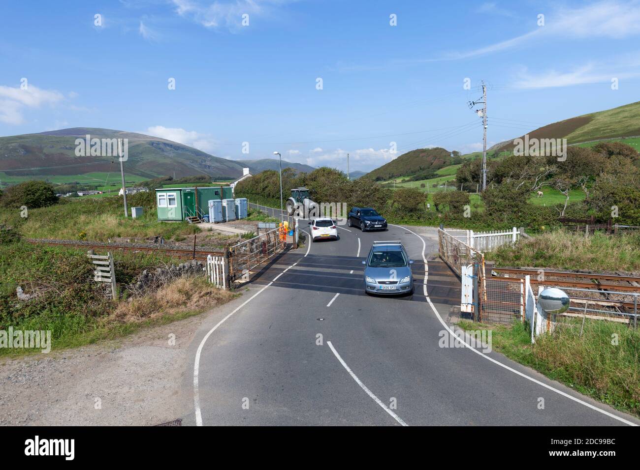Manually operated railway level crossing on a rural road and railway ...
