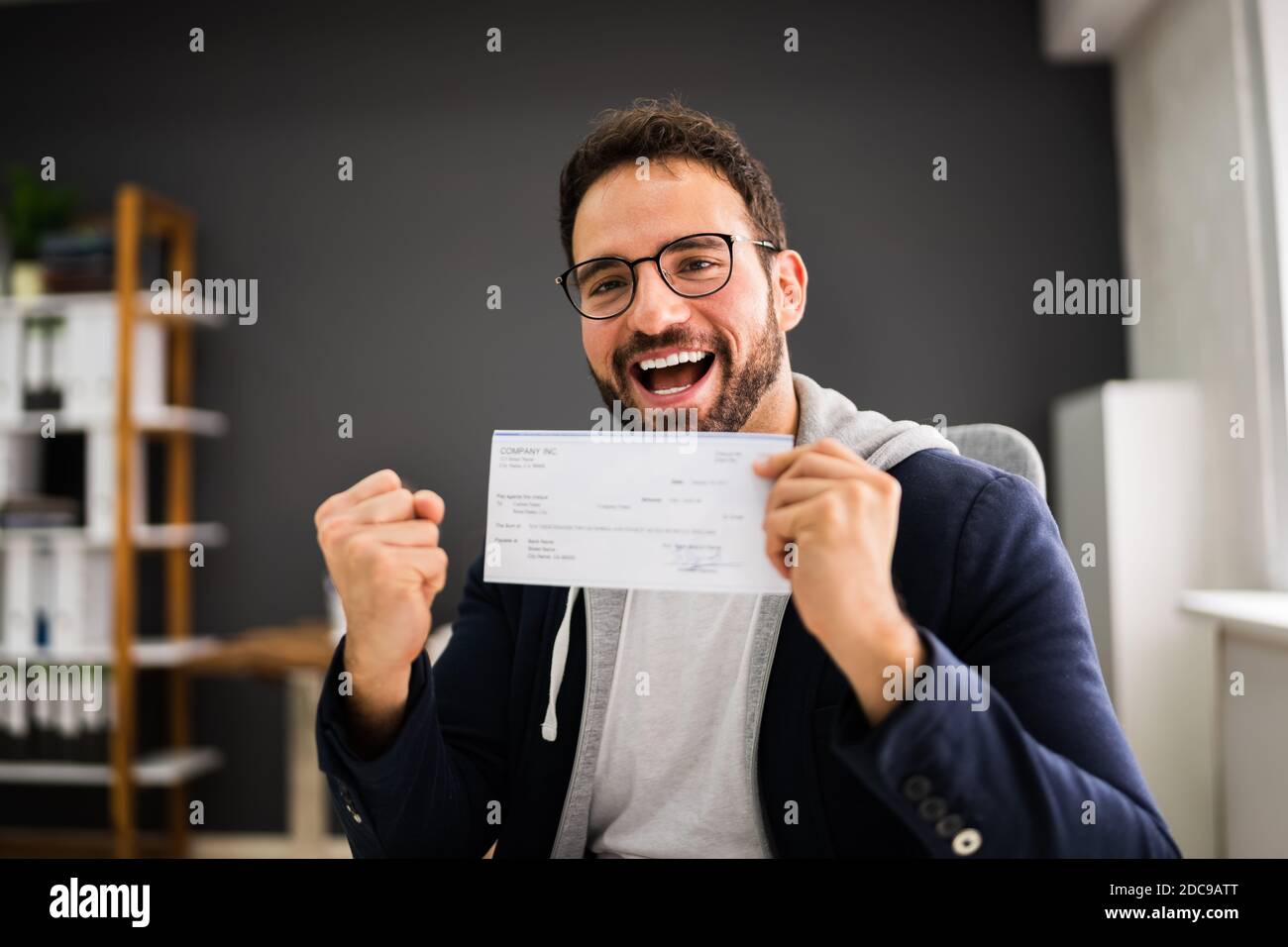 Holding Paycheck Or Payroll Check Or Insurance Cheque In Hand Stock ...