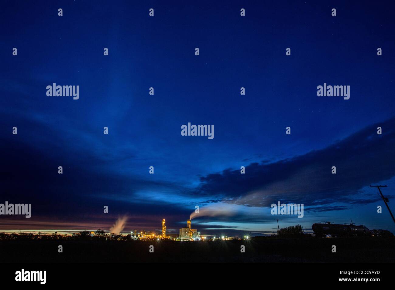 Ominous Storm Clouds Prairie night refinery Fertilizer Stock Photo - Alamy