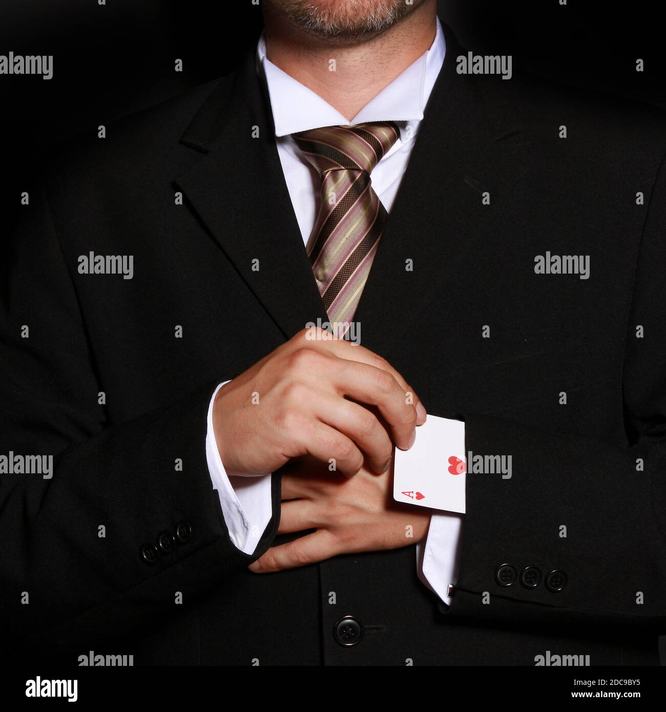 A person cheating while playing cards Stock Photo - Alamy