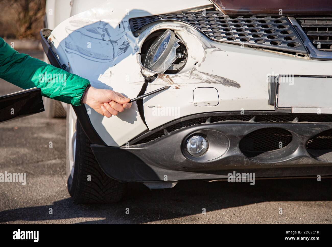 Insurance agent will examine and examine the damage to the car after an ...