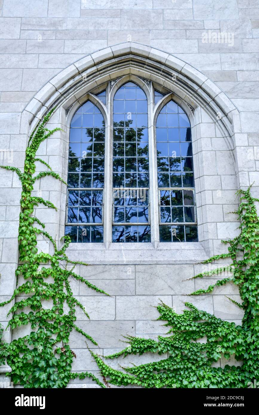 Historic stone chapel and glass arched windows Stock Photo - Alamy