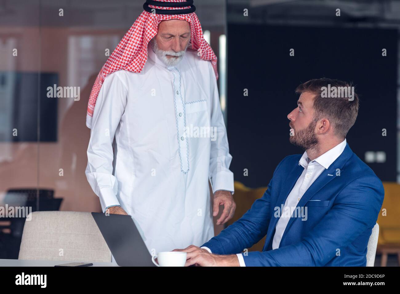 Mature Middle Eastern businessman wearing ghoutra in meeting Stock ...