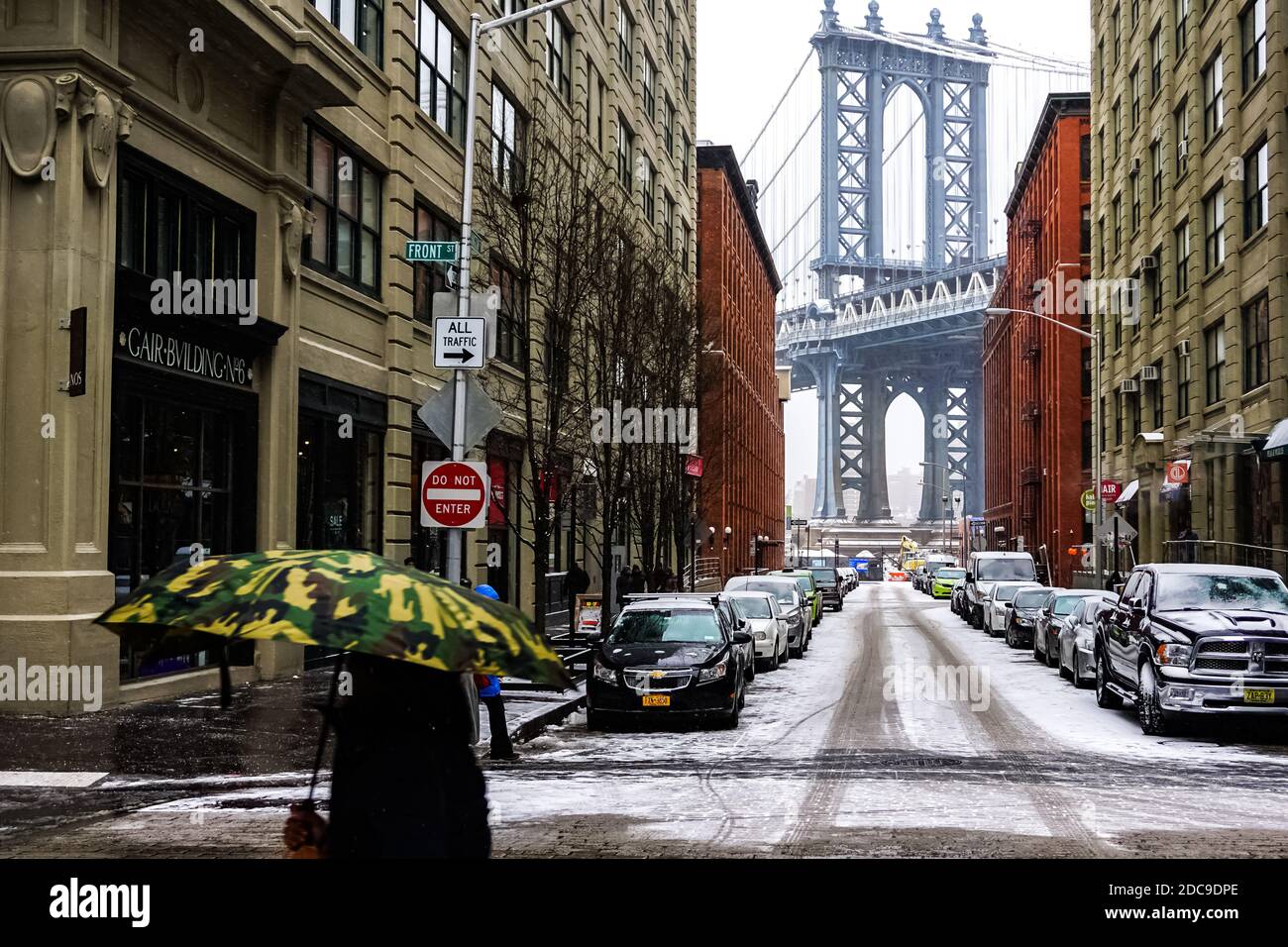 Manhattan Bridge during winter snowstorm blizzard in New York City with ...