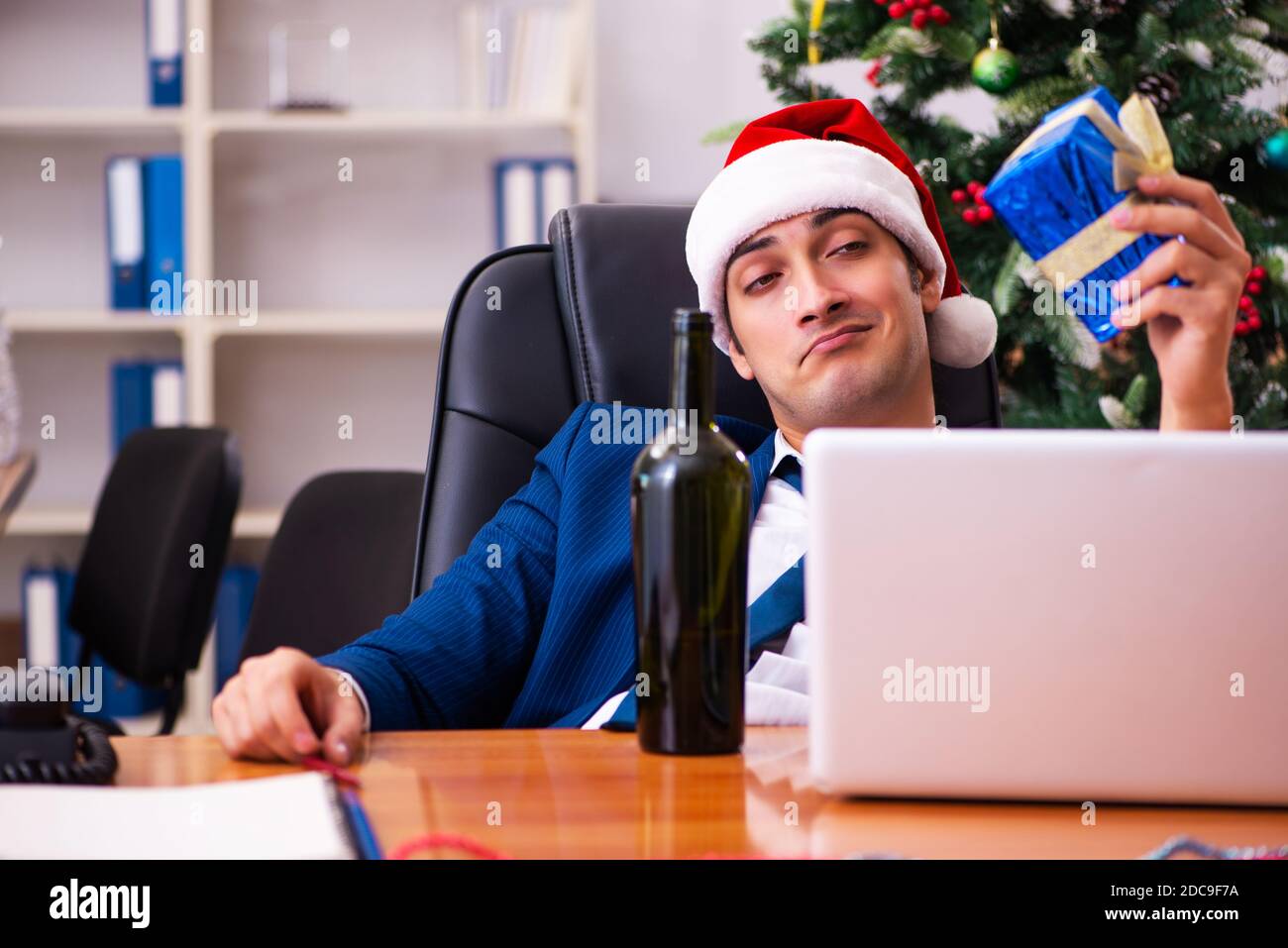 Employee in office during christmas party Stock Photo - Alamy