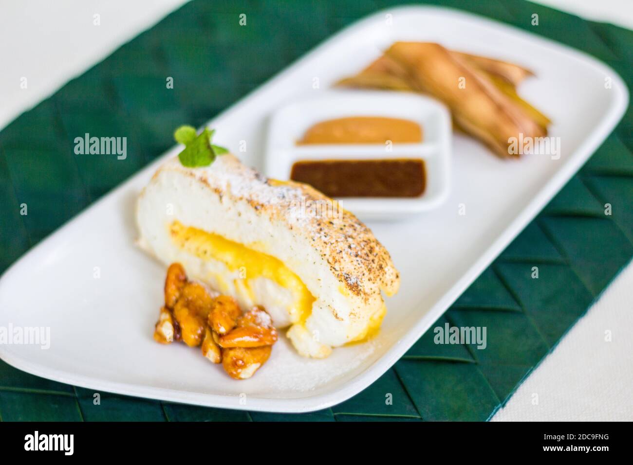 A slice of brazo de mercedes, a traditional Filipino dessert made of ...