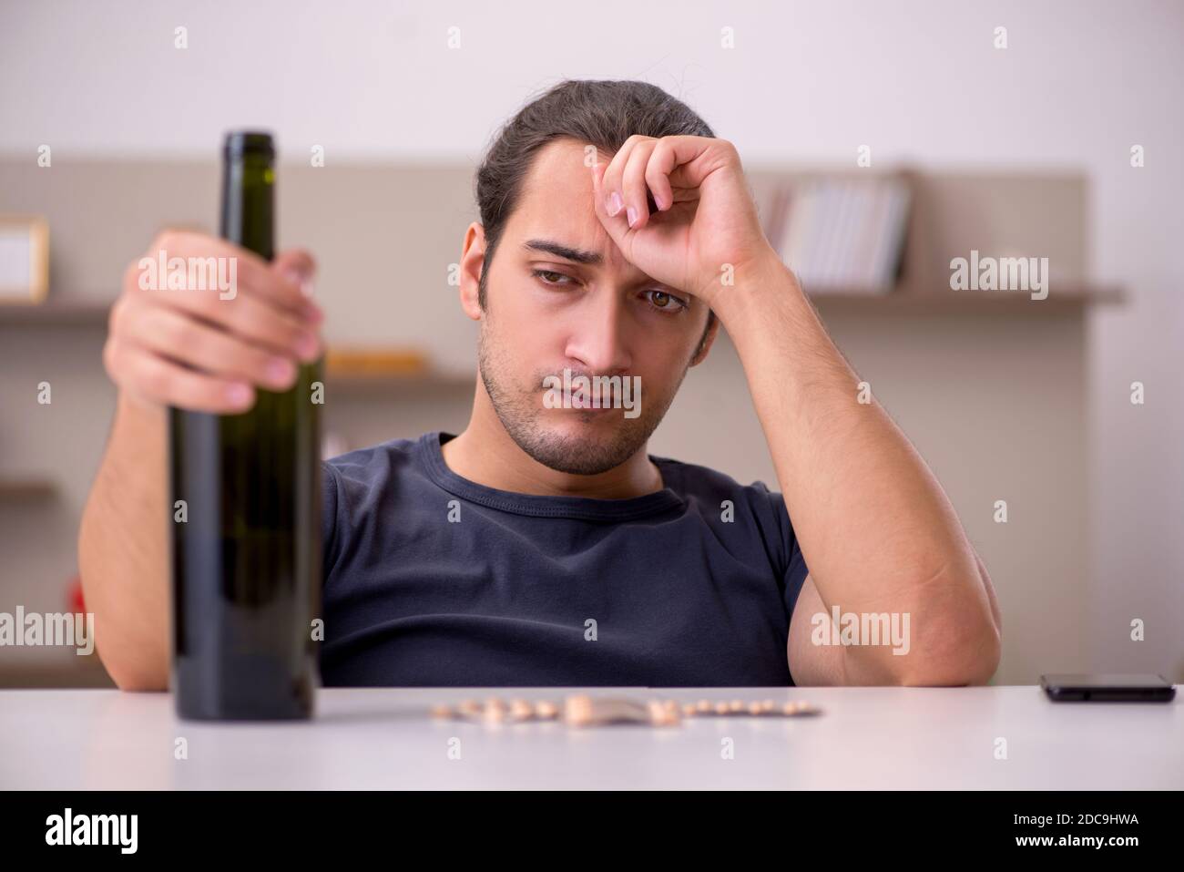 Young sick alcoholic suffering at home Stock Photo - Alamy
