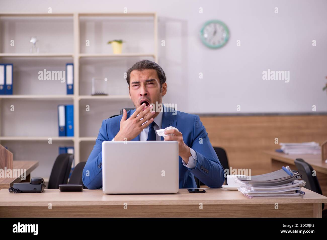 Sick businessman employee suffering at workplace Stock Photo - Alamy