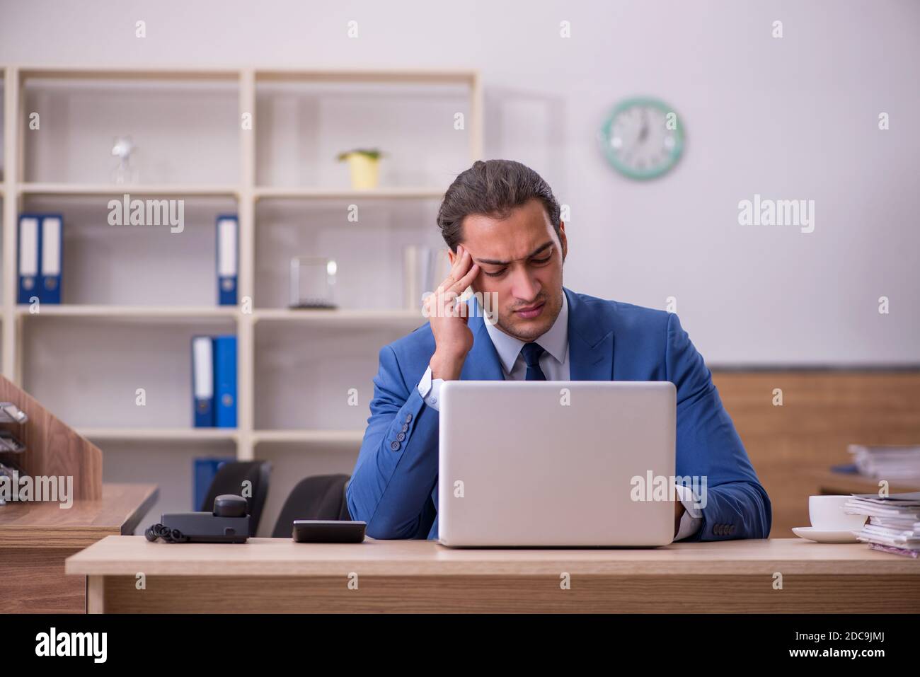 Sick businessman employee suffering at workplace Stock Photo - Alamy