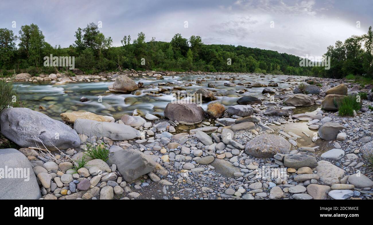 panoramic long exposure of river in spanish pyrenees with rocks Stock ...