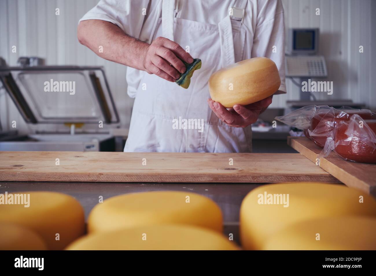 Cheese maker at local production factory Stock Photo - Alamy