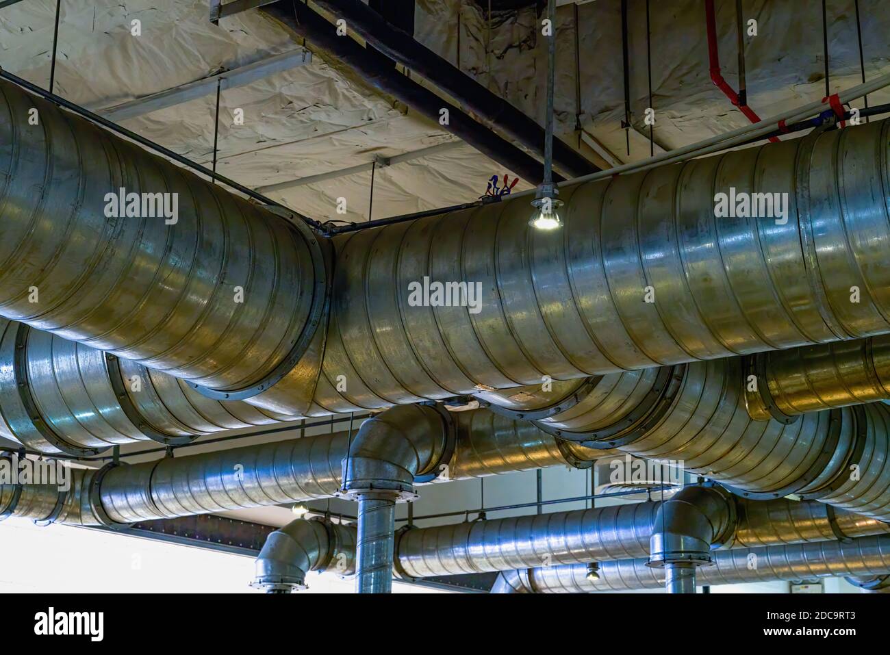 Fume exhaust pipes crisscrossed in the restaurant Stock Photo - Alamy