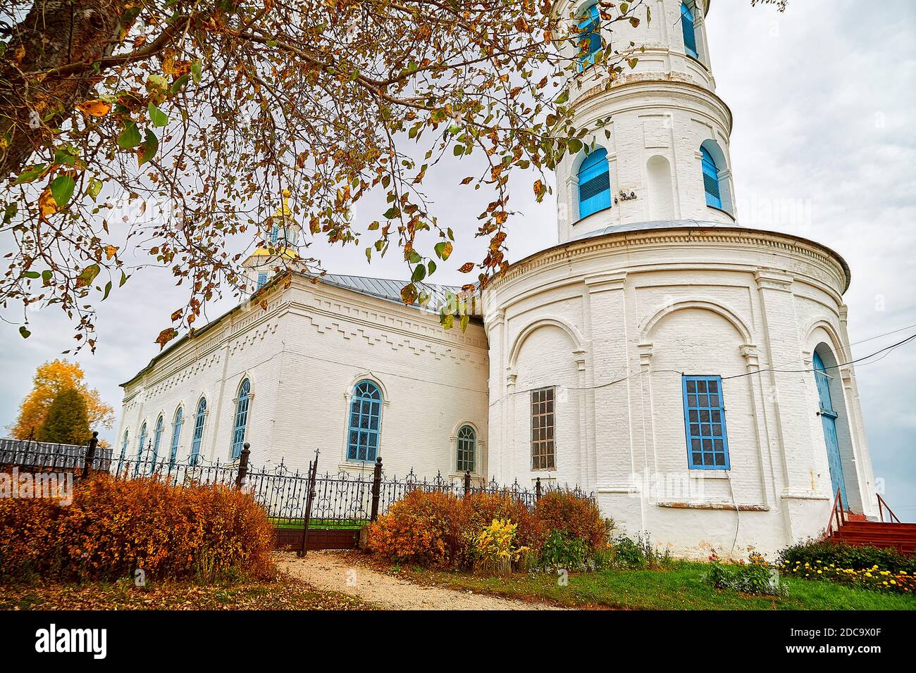 Traditional russian white church with domes in nature landscape in a ...
