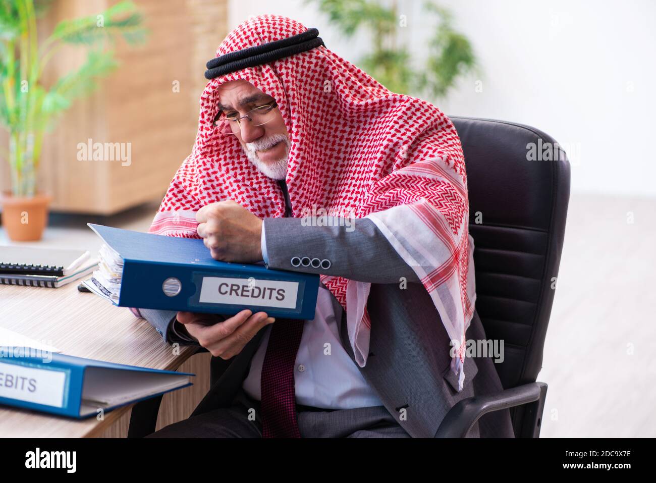 Old arab bookkeeper extremely tired with an excessive work Stock Photo ...