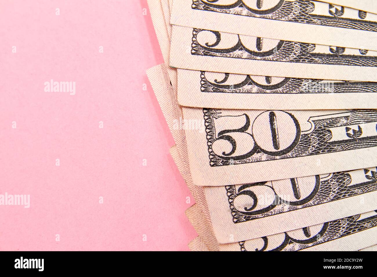 50 US dollar banknotes on pink background Stock Photo - Alamy