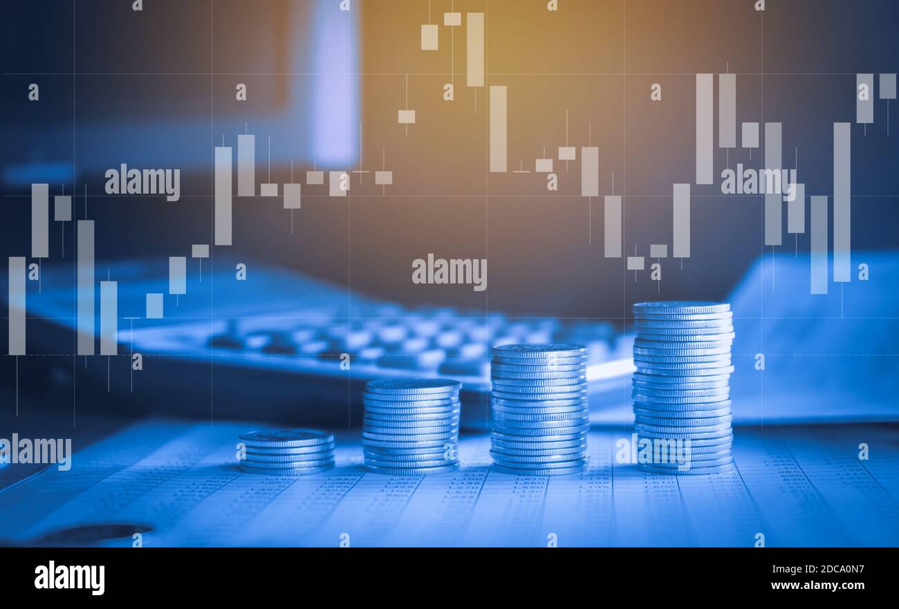 Stack of money coin on accounting sheet with trading graph, financial ...