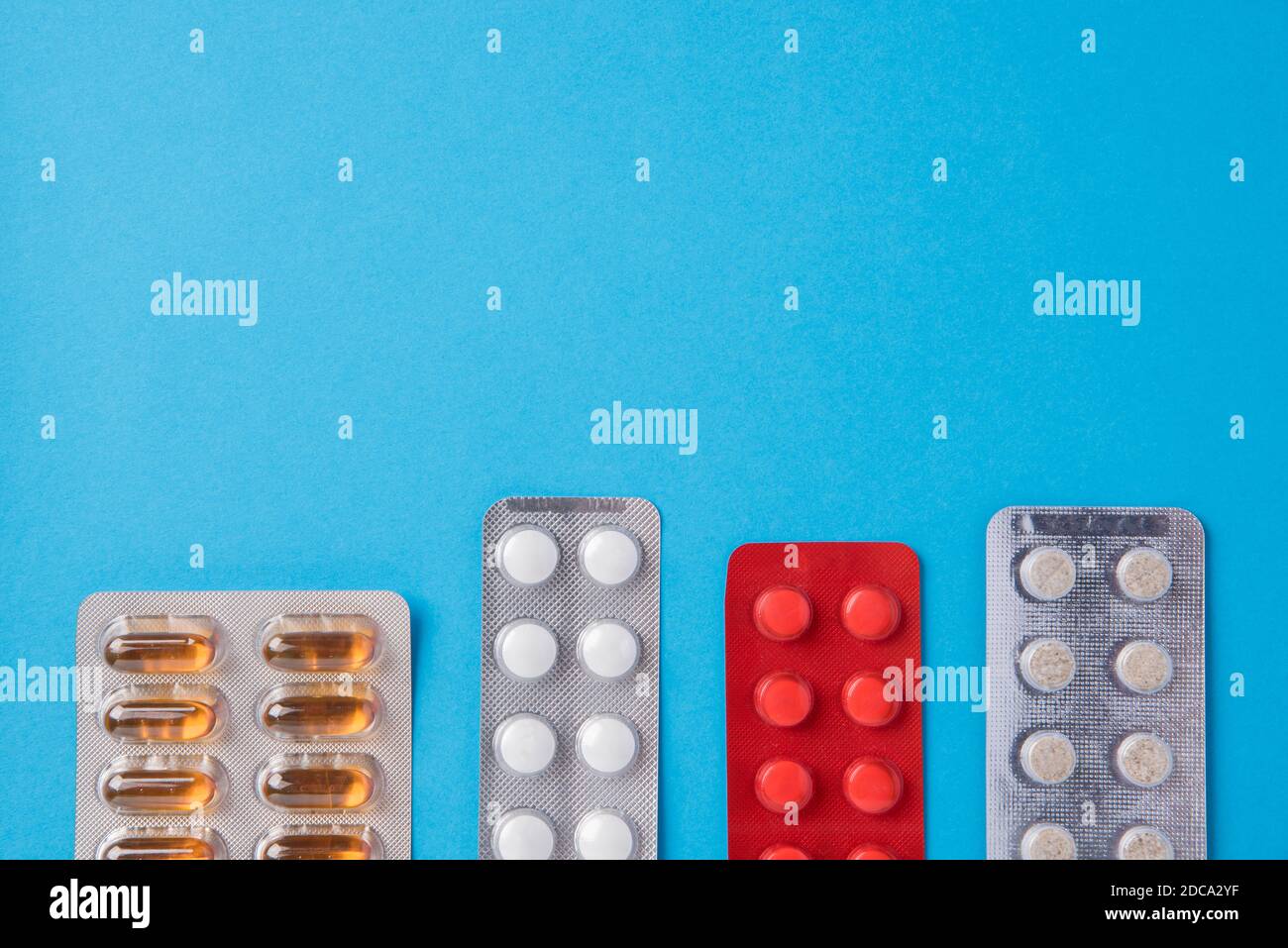 Different tablets and pill painkillers in the package and without it on ...