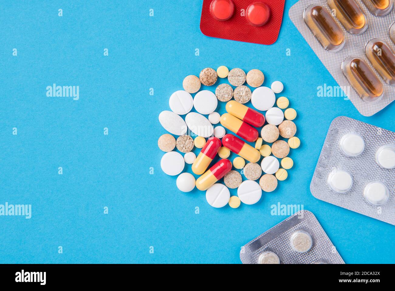 Different tablets and pill painkillers in the package and without it on ...