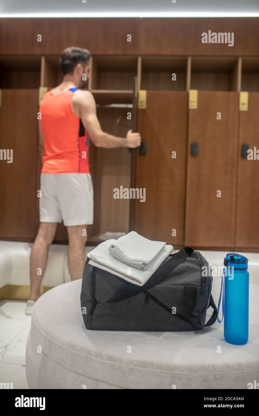 Man changing in locker room hi-res stock photography and images - Alamy