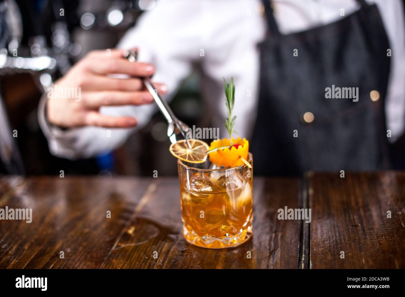 Girl bartender makes a cocktail in the pothouse Stock Photo - Alamy