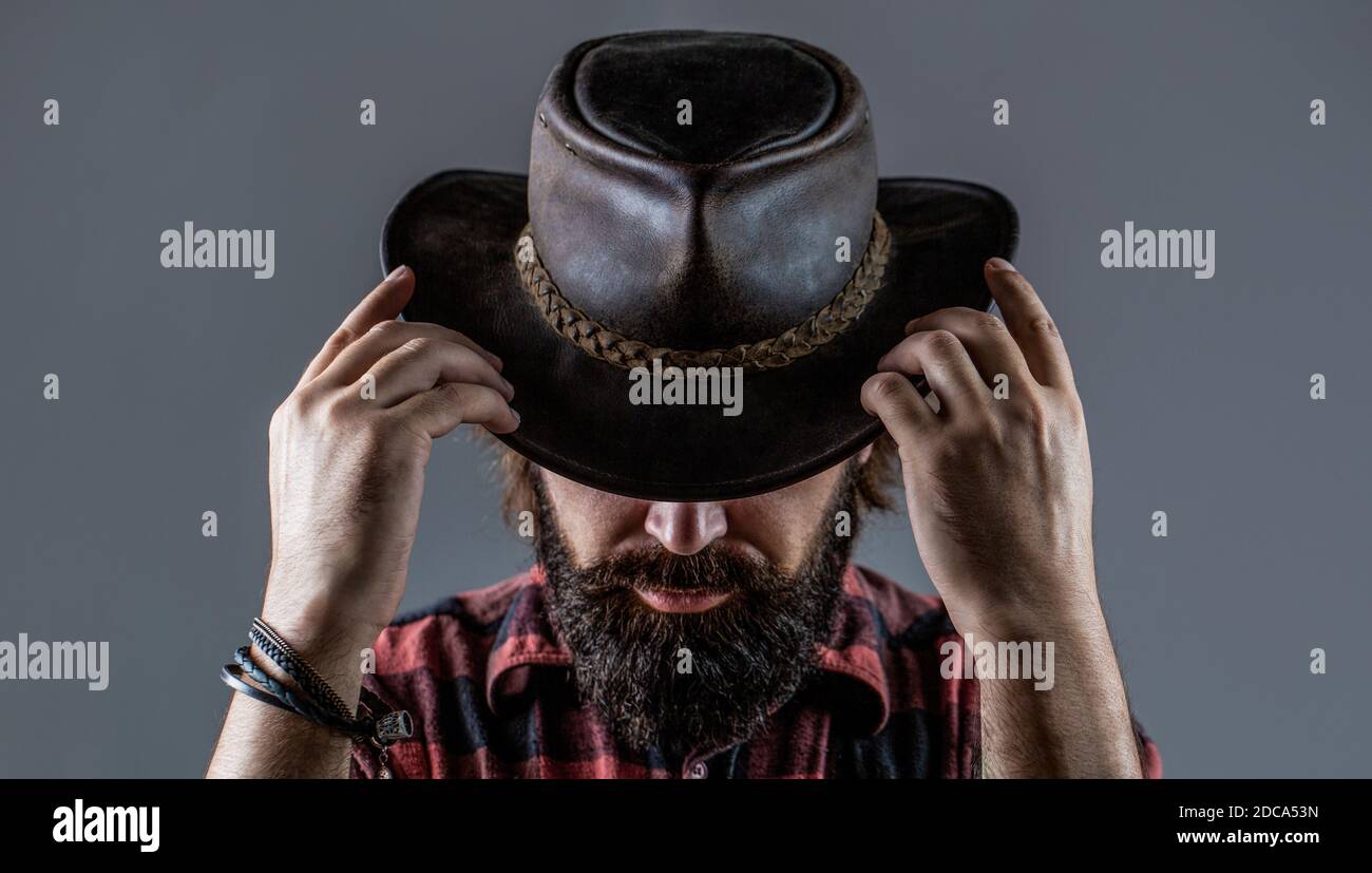 Leather Cowboy Hat. Portrait of young man wearing cowboy hat. Cowboys ...
