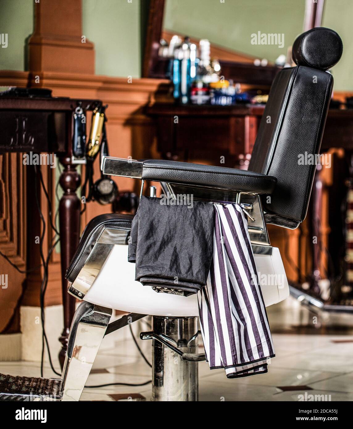 Stylish vintage barber chair. Professional hairstylist in barbershop ...