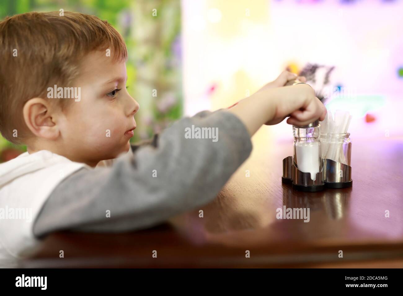 Boy salt food hi-res stock photography and images - Alamy