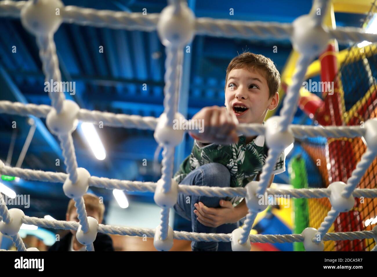 Child on rope net hi-res stock photography and images - Alamy