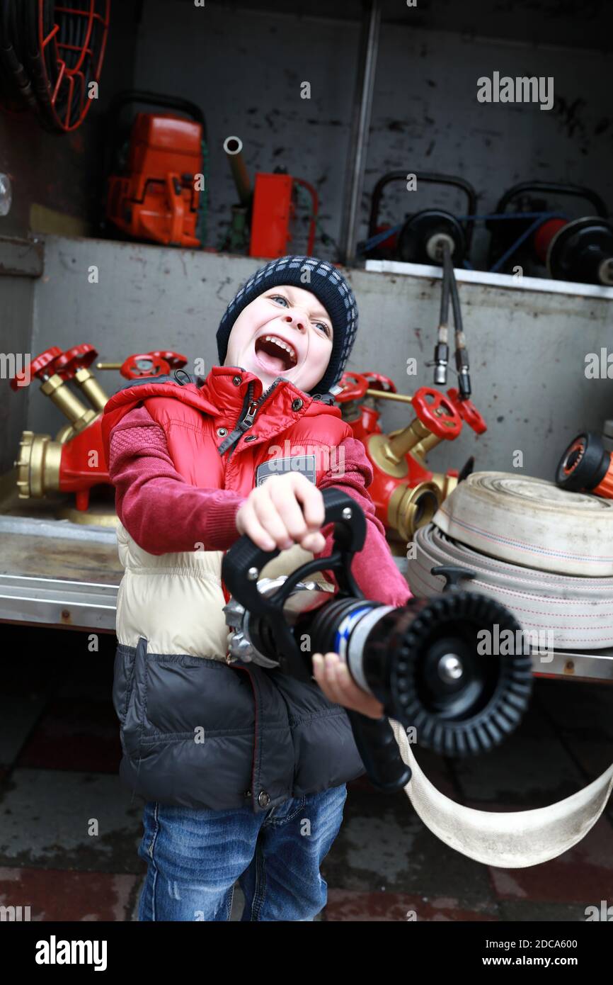 Boy playing with fire truck hi-res stock photography and images - Alamy