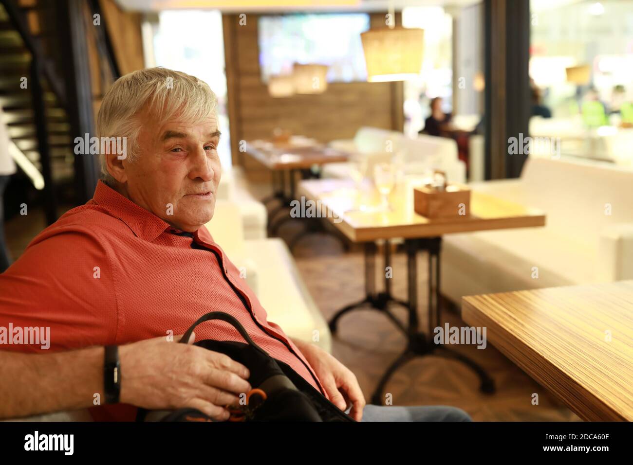 Elderly man alone in restaurant hi-res stock photography and images - Alamy