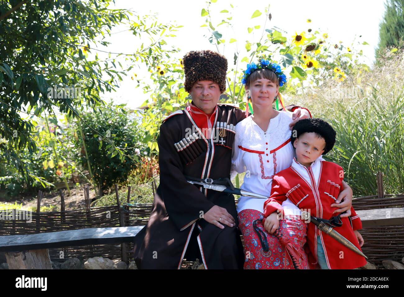 Portrait of family in Cossack costumes in backyard Stock Photo - Alamy