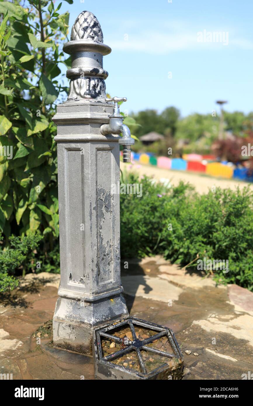 Metal water column in village in summer Stock Photo - Alamy