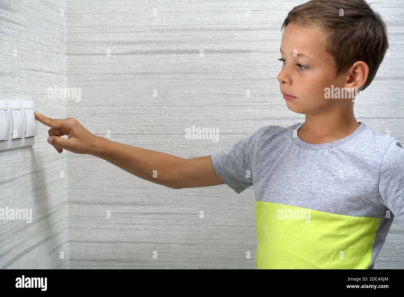 Kid turns off the light at home Stock Photo - Alamy