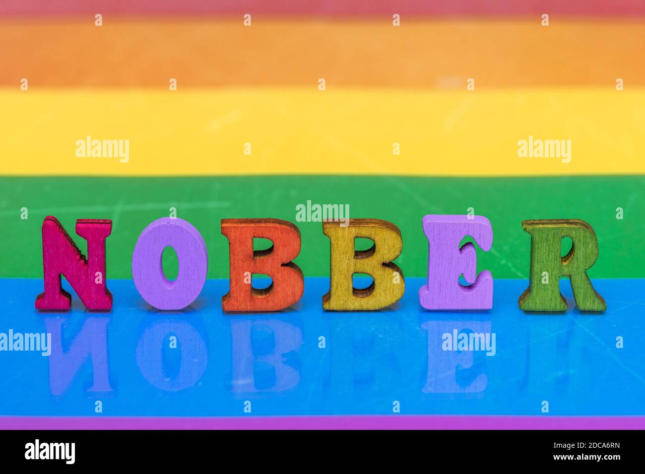 word of multicolored letters nobber which means nine, background LGBT ...