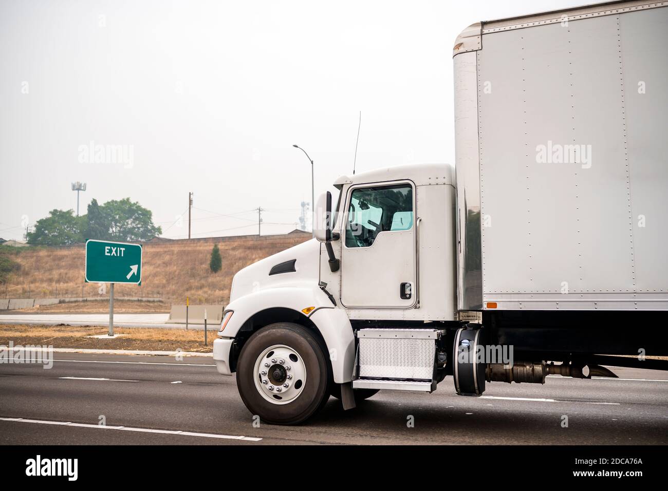 White stylish industrial grade day cab big rig semi truck with box ...