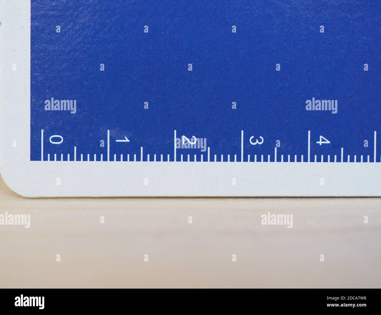 paper ruler with metric units in white over blue Stock Photo - Alamy