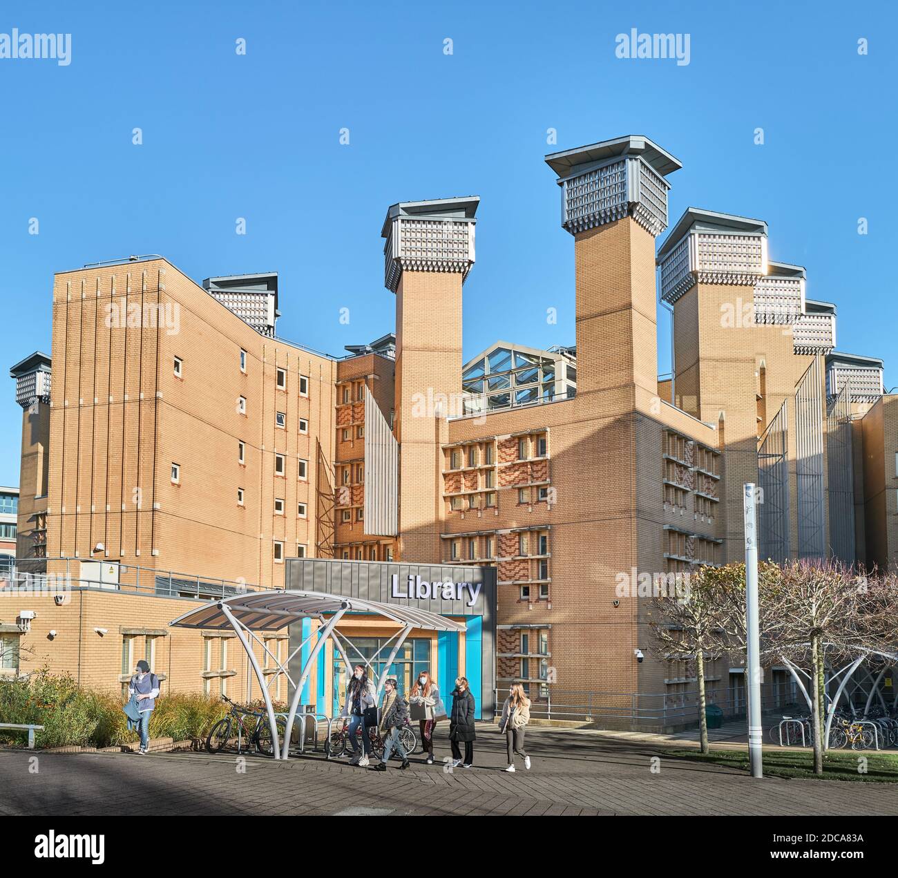 A group of studets leave the Lanchester library, uinversity of Coventry ...