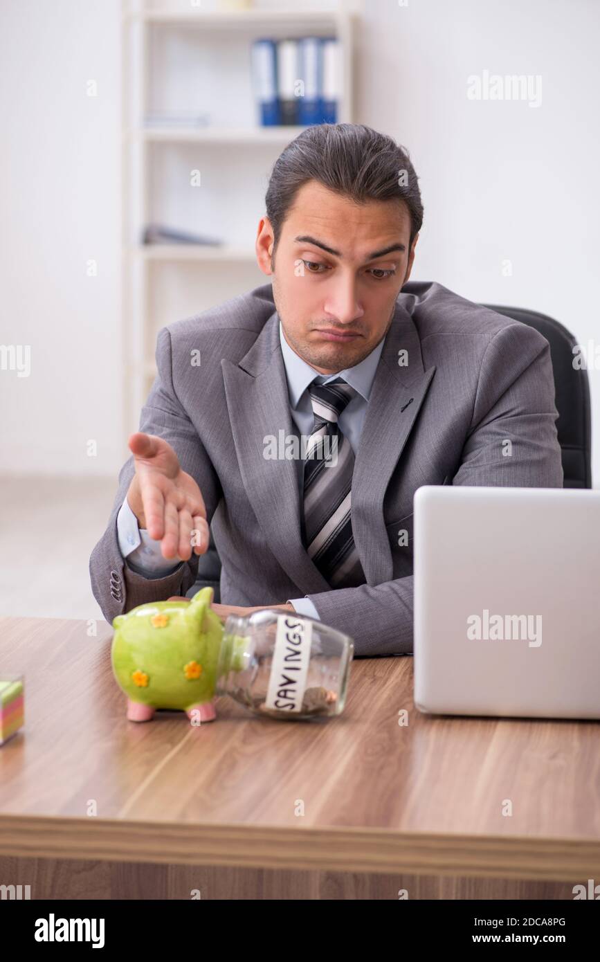 Young employee in pension concept at workplace Stock Photo - Alamy