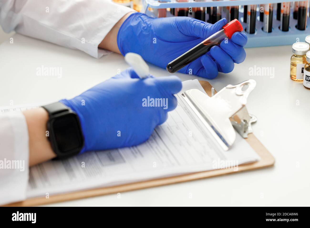 Doctor making blood analysis hi-res stock photography and images - Alamy