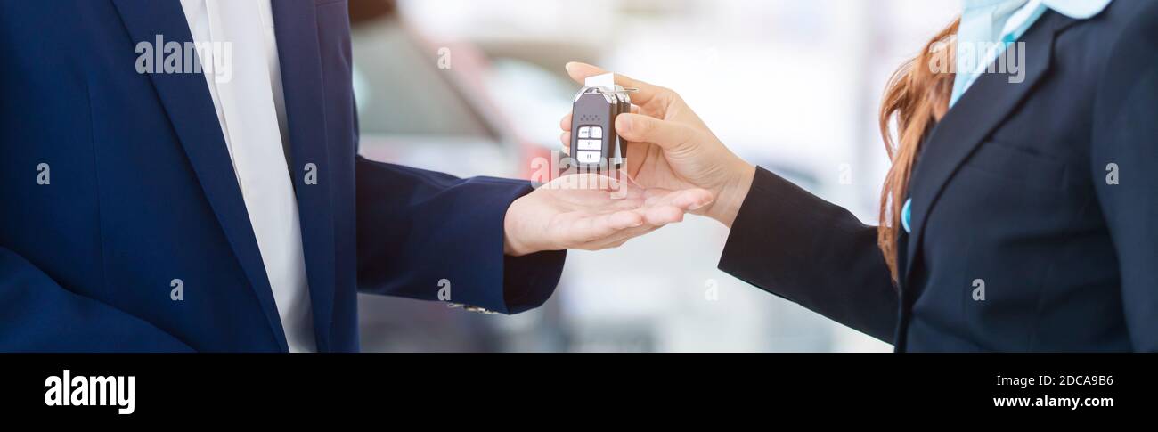 Auto business banner background, close up of dealer giving key to new ...