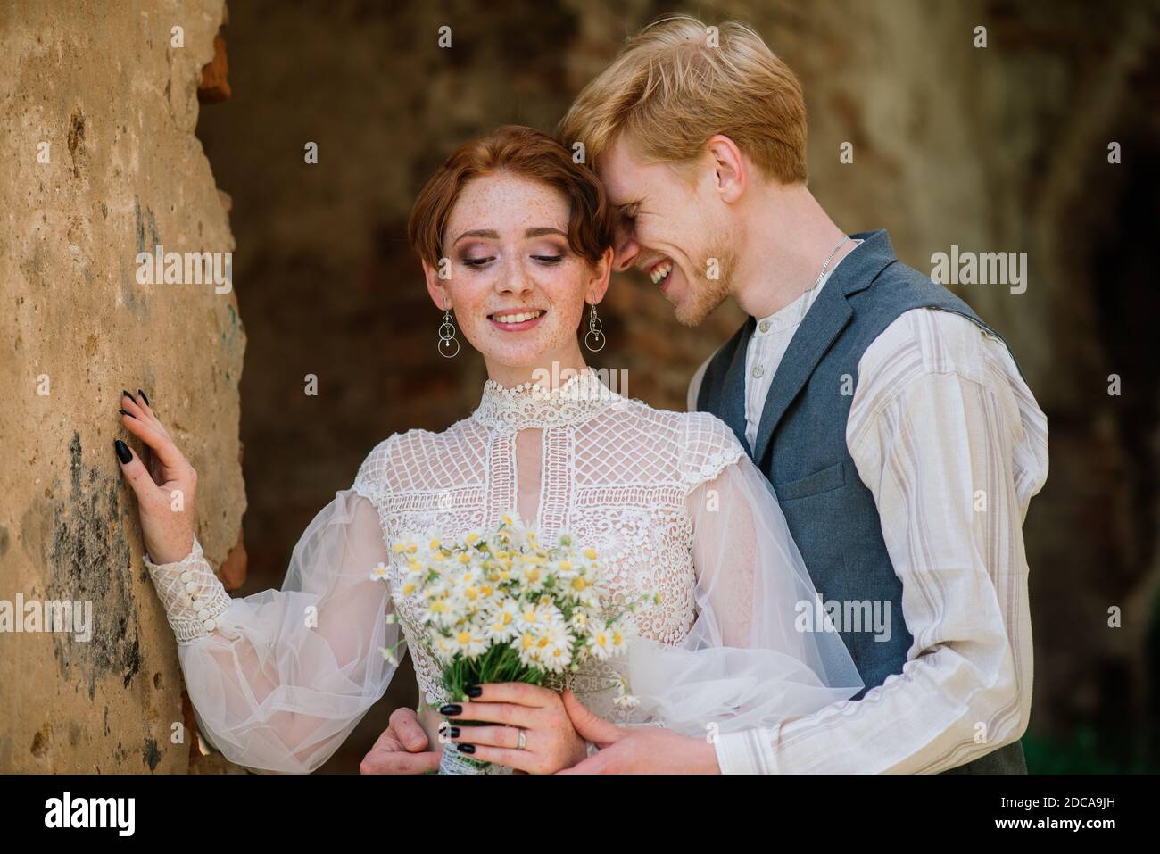 Very nice redhead young just married happy couple kissing in the sunset ...