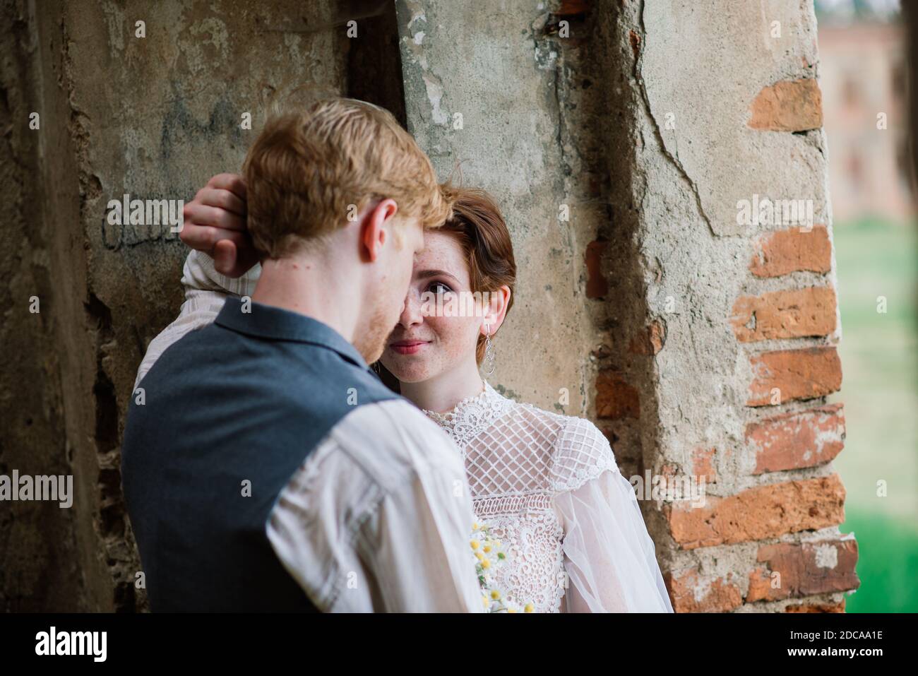 Very nice redhead young just married happy couple kissing in the sunset ...