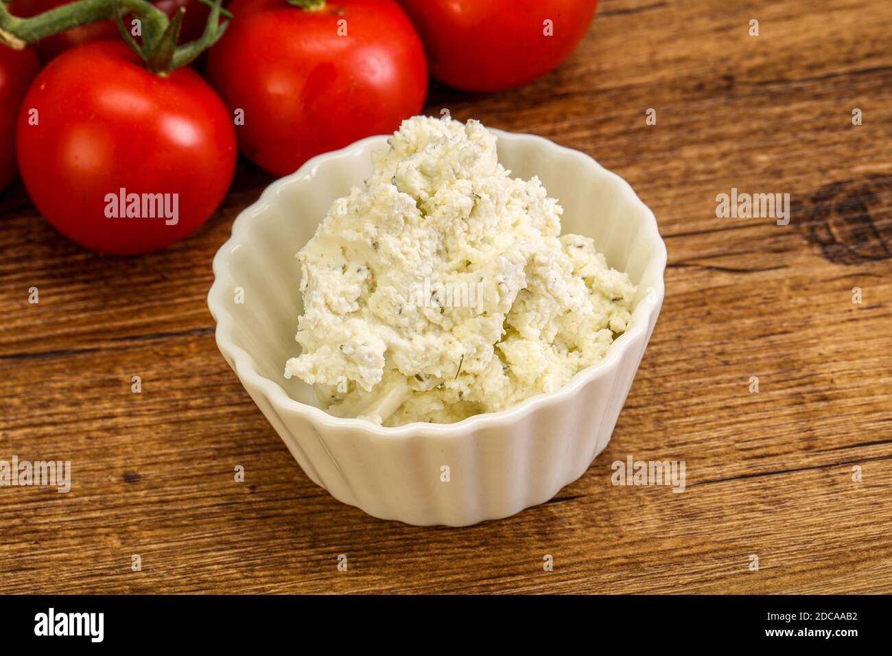 Soft cream cheese with herbs in the bowl Stock Photo - Alamy