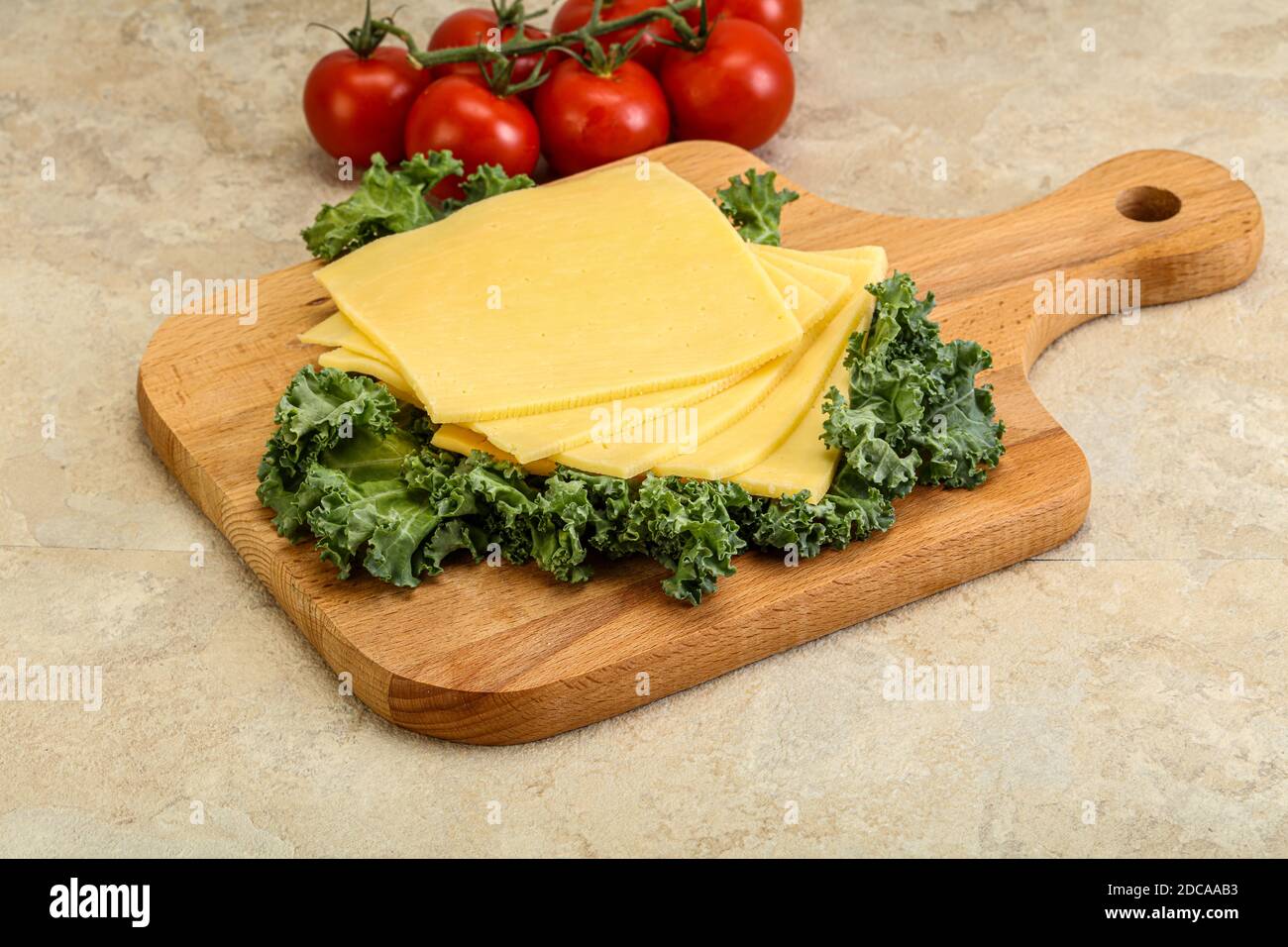 Sliced Gauda cheese snack over board Stock Photo - Alamy